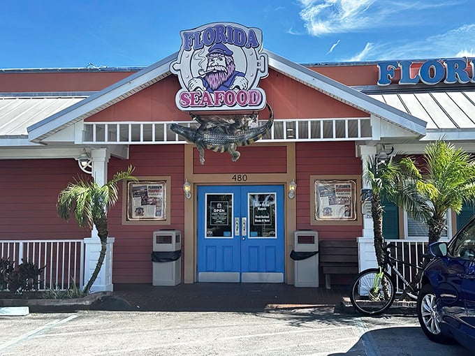 The coral-colored exterior with its bright blue doors screams "Old Florida charm" &ndash; before you even step inside for those legendary gator bites.