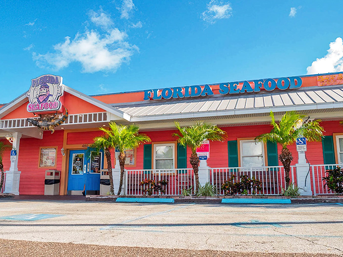 The coral-colored beacon of seafood salvation, complete with an alligator doorman who's clearly not getting paid enough for this gig.