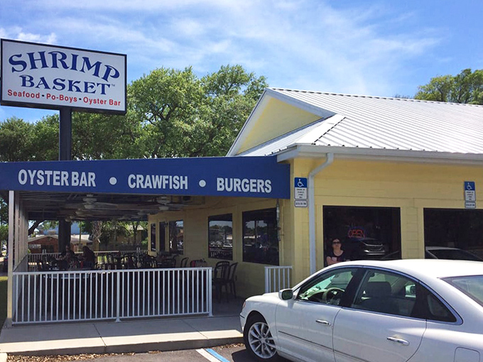 This cheerful yellow building might look humble, but it's hiding serious seafood secrets behind those blue awnings.