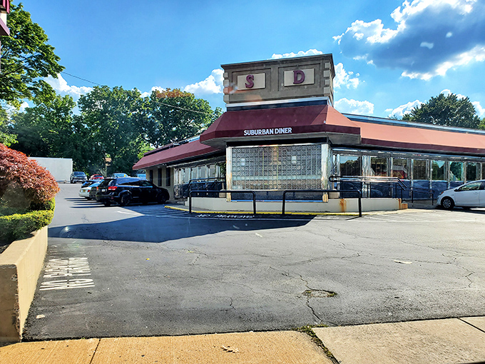 The classic diner silhouette that promises comfort before you even walk through the door. That "Baking On Premises" sign is the food equivalent of "In God We Trust."