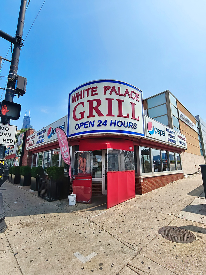 From another angle, the vintage signage proudly announces its round-the-clock commitment to feeding Chicago, rain or shine, day or night.