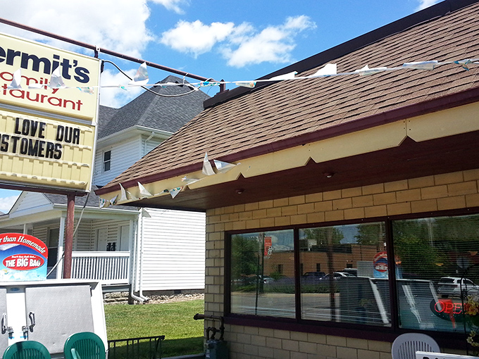 The iconic yellow brick exterior of Kermit's welcomes hungry travelers with its charming patio and promise of home-cooked comfort.
