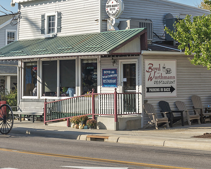 The unassuming white exterior of Boyd & Wurthmann belies the culinary treasures within. Those rocking chairs aren't just decoration&mdash;they're time machines to a simpler era.