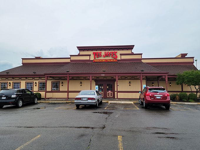 The red sign beckons like a lighthouse for hungry travelers. Tee Jaye's Country Place stands proud against the Ohio sky, promising comfort food salvation inside.