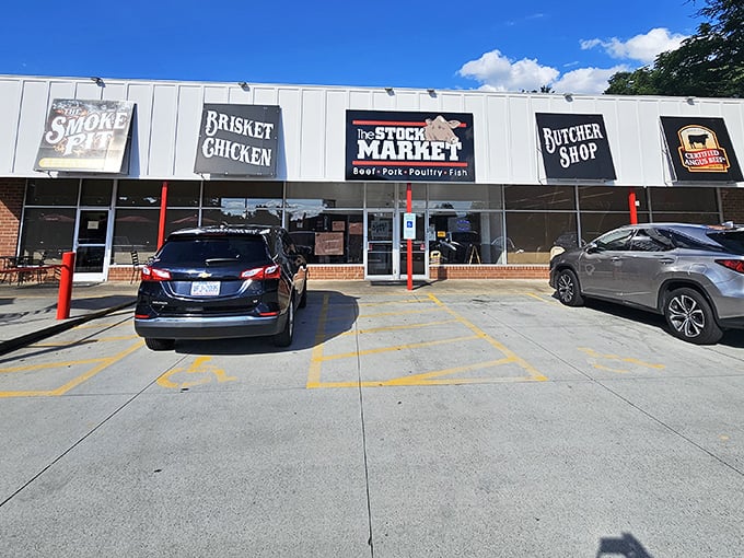 The unassuming strip mall exterior of The Smoke Pit&mdash;proof that the best barbecue joints often hide in plain sight.