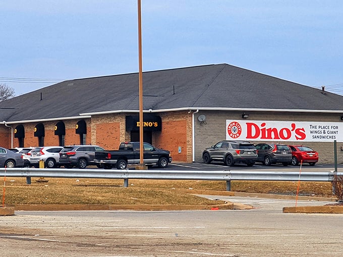 The unassuming brick exterior of Dino's Sports Lounge hides a wing paradise within, like finding a treasure chest disguised as an ordinary box.