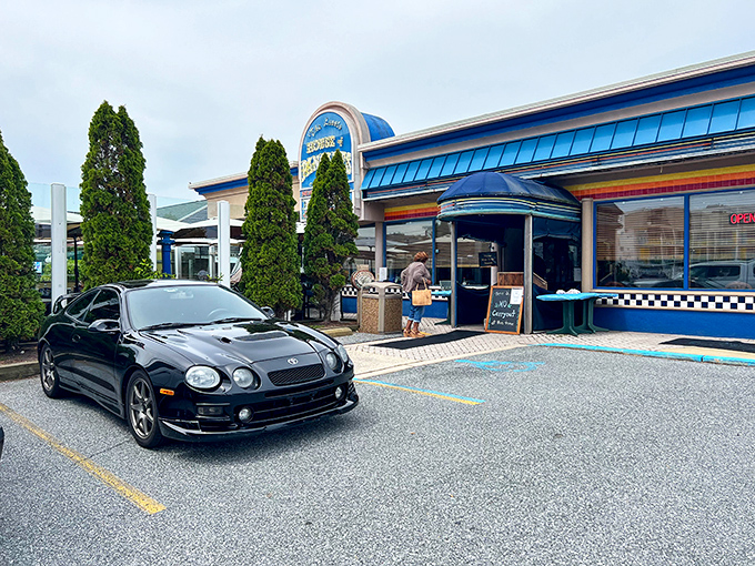 The iconic blue sign of The Little House of Pancakes stands like a beacon for breakfast lovers, promising pancakes, ribs, and culinary happiness.