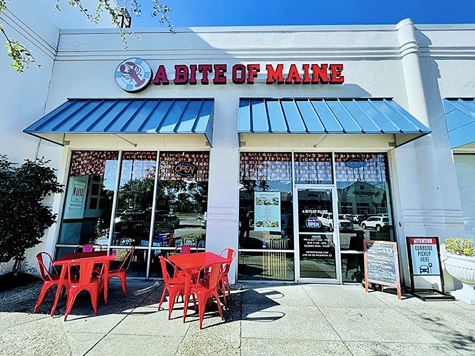 The bright red sign of A Bite of Maine stands out like a lighthouse beacon, guiding hungry seafood lovers to this coastal oasis in Virginia Beach.
