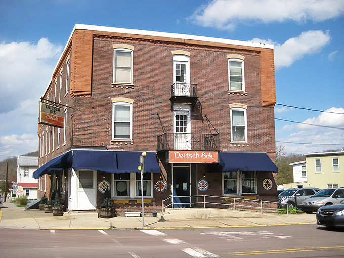 The corner brick building with blue awnings stands like a time capsule of Pennsylvania Dutch tradition, beckoning hungry travelers to step inside and stay awhile.