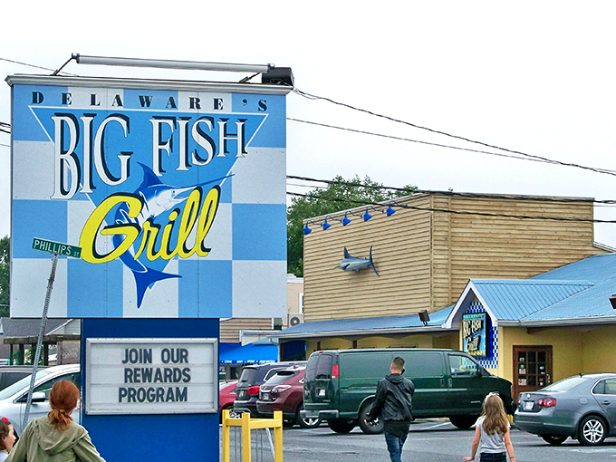 That cheerful blue and white checkered facade practically waves hello, promising maritime treasures inside this Delaware gem.