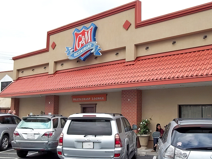 The iconic red-roofed G&M Restaurant stands like a culinary lighthouse, beckoning seafood lovers from miles around to its Linthicum Heights haven.