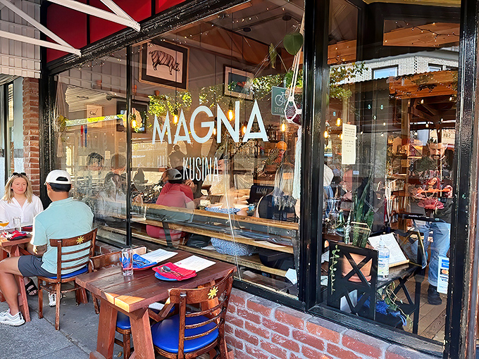 Like a warm invitation written in glass and wood, this storefront whispers promises of Filipino culinary adventures.