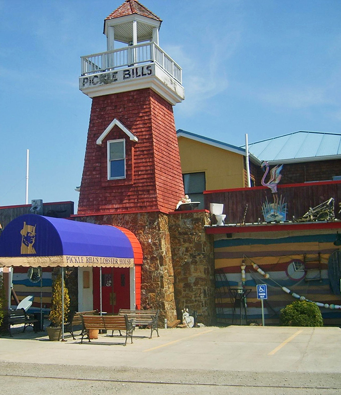 The iconic lighthouse tower at Pickle Bill's stands like a beacon for hungry seafood lovers, guiding them to this colorful nautical oasis in Ohio.