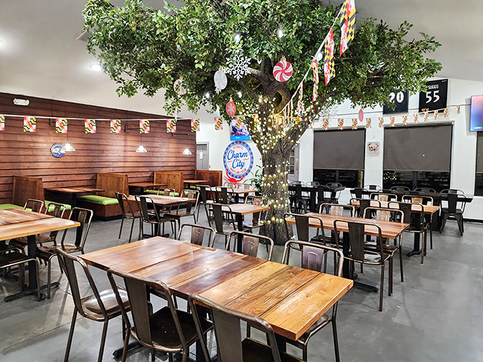 The whimsical indoor tree at Charm City creates a magical dining atmosphere where seafood dreams come true.
