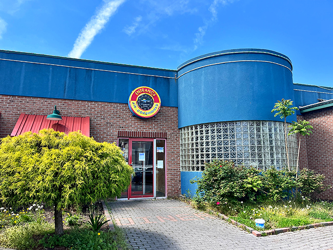 The distinctive blue curved exterior of Rehoboth Diner stands like a beacon of breakfast hope against the Delaware sky.