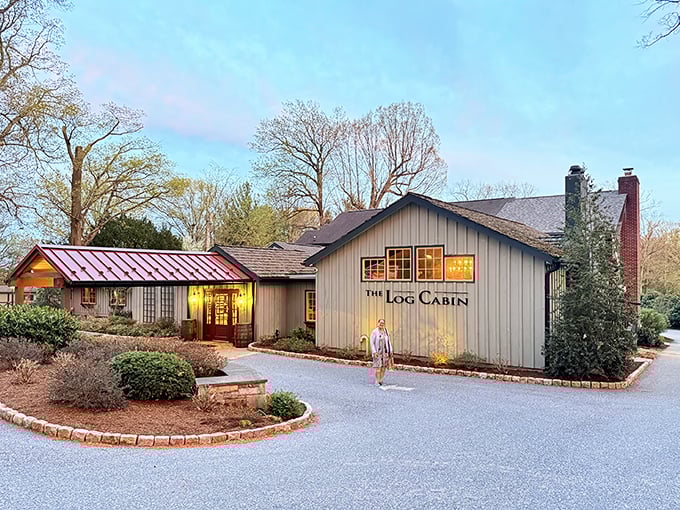 The Log Cabin stands proudly against Pennsylvania's blue sky, its rustic charm beckoning hungry travelers like a culinary lighthouse in Amish country.