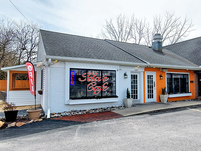The white facade with bold red "Ida's Cafe" lettering isn't shouting for Instagram fame—it's too busy perfecting what matters: the food waiting inside those welcoming doors.