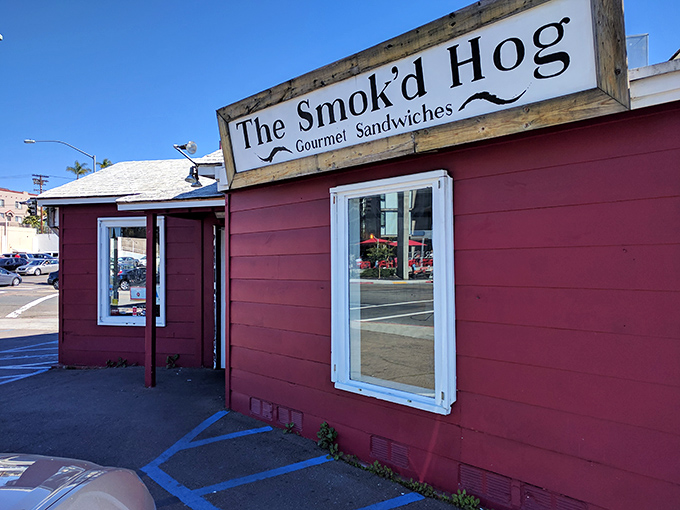 The burgundy shack with "Gourmet Sandwiches" on the sign isn't lying. Barbecue paradise often comes in humble packages.