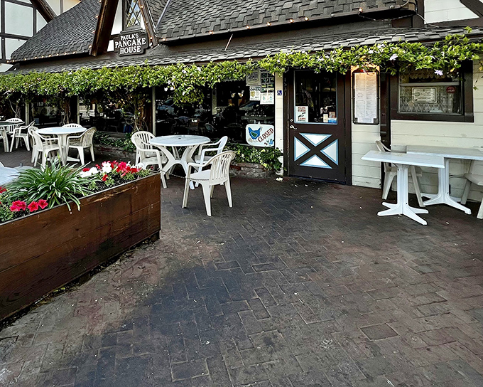 The exterior of Paula's Pancake House, with its warm wooden accents and inviting outdoor tables and chairs, sets the stage for a breakfast experience that blends California sunshine with Danish-inspired charm.