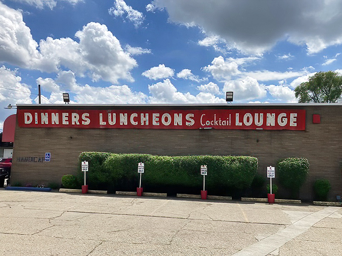 The unassuming exterior of Loui's Pizza proves once again that the best food experiences often hide behind the most modest facades.