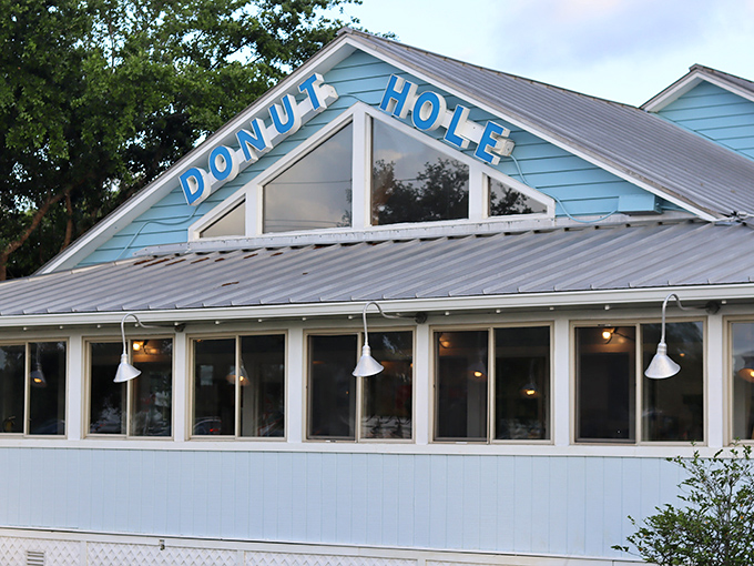 The iconic blue sign promises paradise in pastry form. Like a lighthouse for the hungry, it beckons with the magic words: "Fresh Key Lime Pies Made Daily."