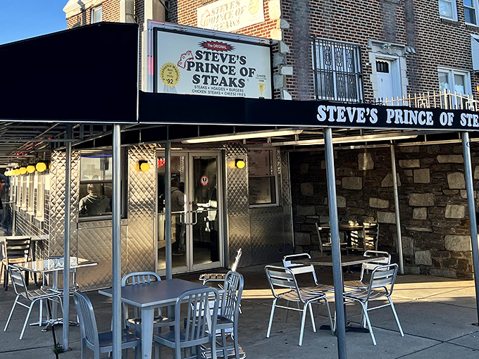 The stone facade of Steve's Prince of Steaks stands like a humble castle where Philadelphia's sandwich royalty holds court daily.