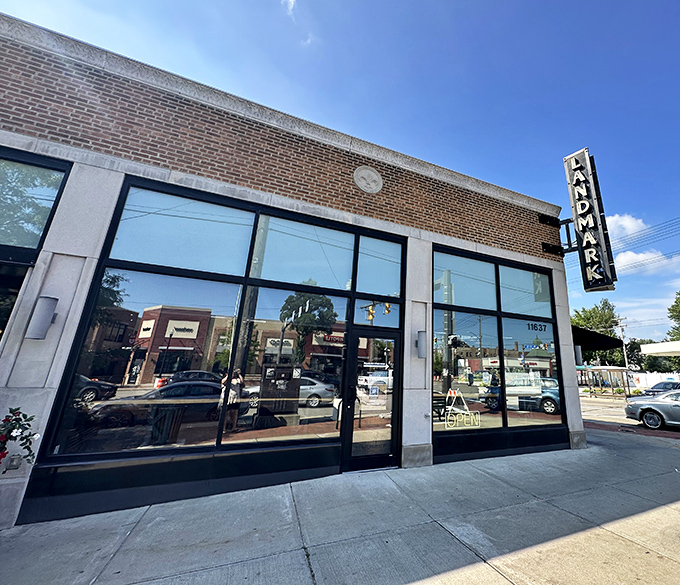 The unassuming brick exterior of Landmark Smokehouse belies the flavor explosion waiting inside. That vertical sign is basically a beacon for BBQ pilgrims.