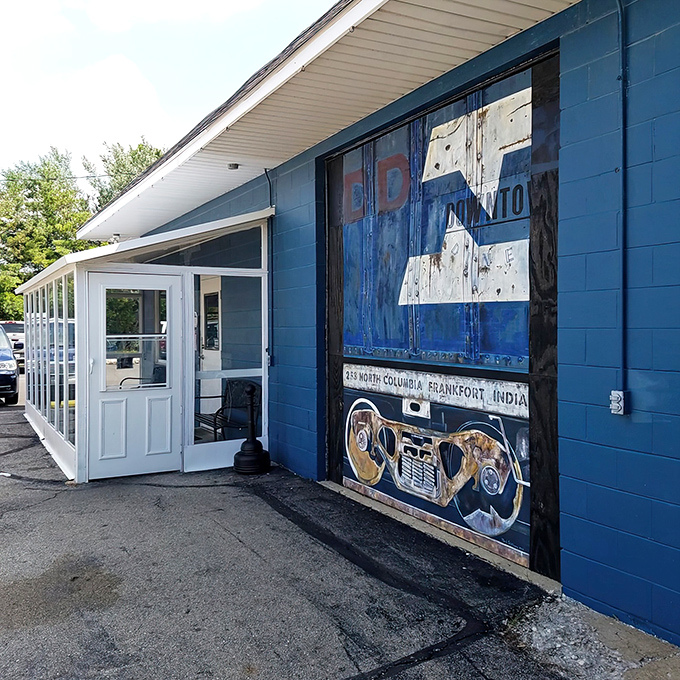 The blue exterior of Downtown Diner stands like a beacon of breakfast hope in Frankfort, complete with railroad crossing sign that promises your taste buds are about to be on the right track.