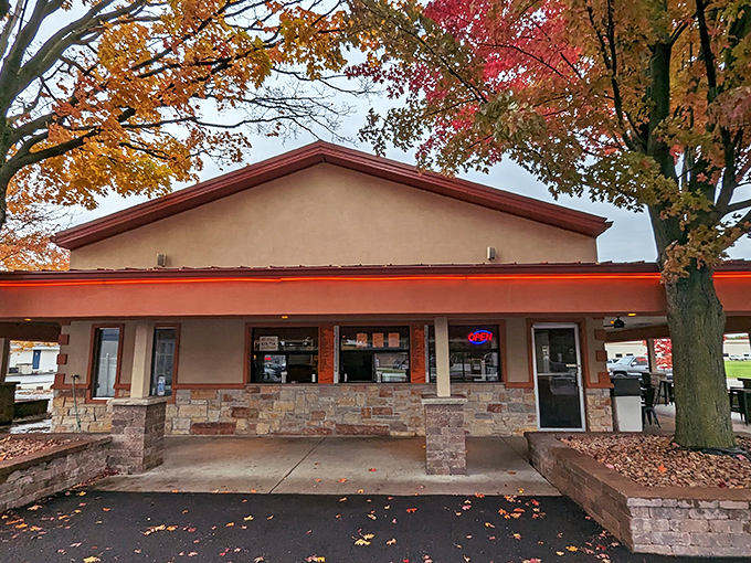 Jaenicke's stone-and-stucco exterior framed by autumn leaves creates that perfect nostalgic vibe that says "comfort food lives here."