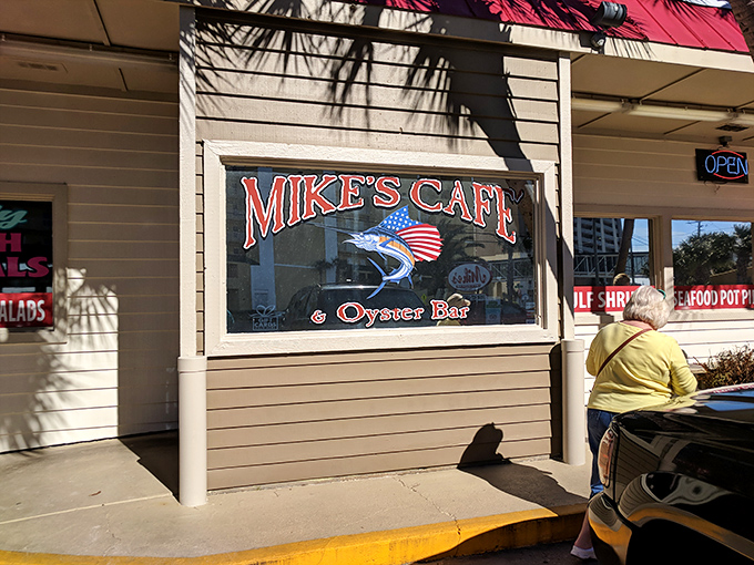 The iconic red roof of Mike's Cafe beckons seafood lovers like a lighthouse guiding hungry sailors home to port.
