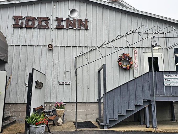 The unassuming white exterior of The Log Inn hides culinary treasures within, like finding a five-star restaurant disguised as your grandparents' house.