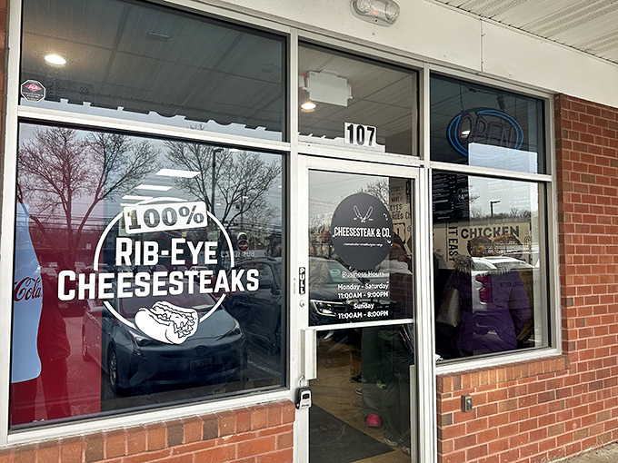The unassuming storefront boldly proclaims "100% RIB-EYE CHEESESTEAKS" &ndash; a siren call to sandwich lovers hiding in plain sight at Rowanberry Center.