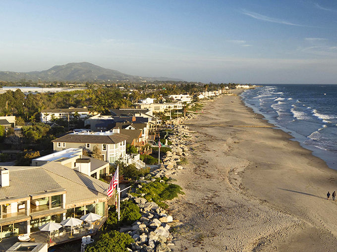 Carpinteria's coastline stretches like nature's welcome mat, where beachfront homes and mountain views create California's perfect postcard moment.