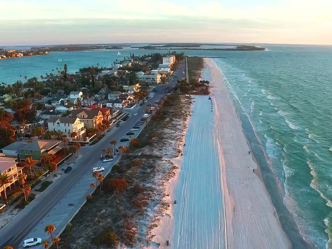 Sunset paints Pass-a-Grille's shoreline in golden hues, transforming humble beach cottages into million-dollar postcards that money can't buy.