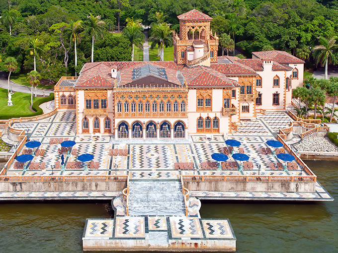 From above, the mansion's terracotta roof tiles and intricate marble terrace create a Mediterranean mosaic that would make Italian architects nod in approval.