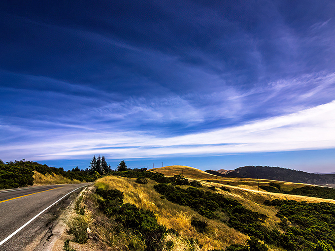 Skyline Boulevard stretches before you like nature's welcome mat, inviting you to discover the rolling golden hills and endless blue skies of Northern California.