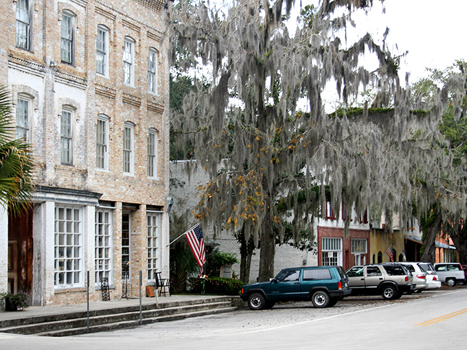 Historic buildings line Cholokka Boulevard, Micanopy's main street, where time seems to slow down under the watchful gaze of moss-draped oaks.