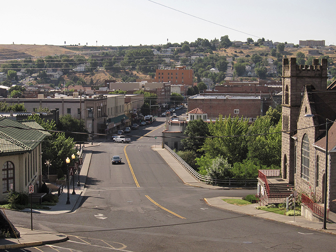 Pendleton's downtown stretches before you like a Western film set come to life, where historic architecture meets small-town charm beneath golden Oregon hills.