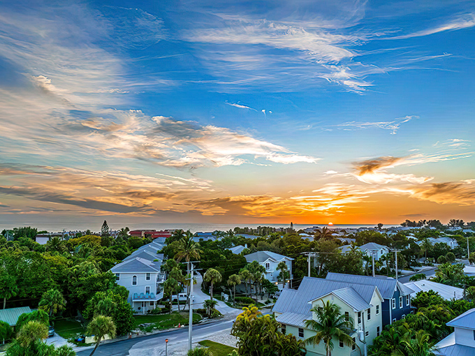 Sunset paints the sky in impossible hues over Anna Maria's rooftops, nature's nightly masterpiece that never gets old.
