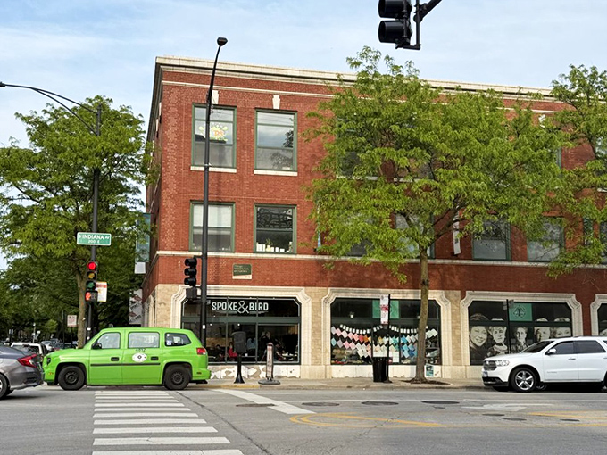 The classic Chicago brick exterior of Spoke & Bird stands proudly on the corner, that bright green vehicle practically screaming, "Something delicious happens here!"