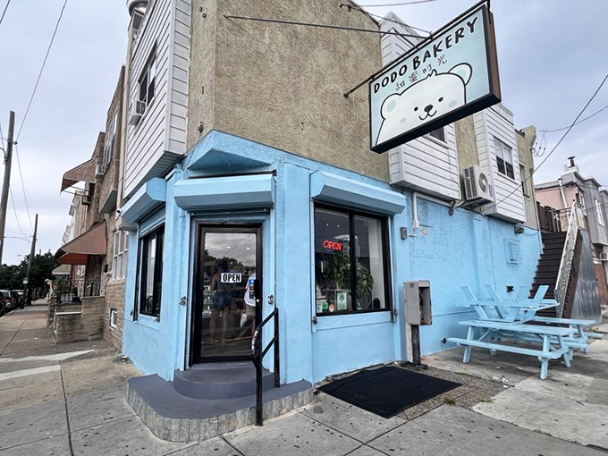 The cheerful blue exterior of Dodo Bakery stands out like a dessert oasis in Philadelphia, complete with that adorable polar bear mascot beckoning you inside.