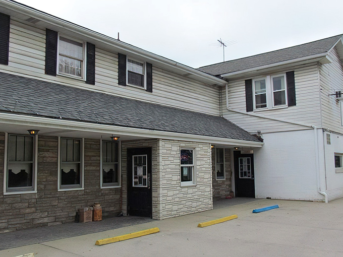 The unassuming exterior of Breezy Heights Tavern proves once again that culinary treasures often hide behind the most modest facades. Established 1927 and still drawing crowds.