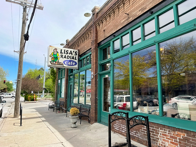 The iconic green-trimmed exterior of Lisa's Radial Cafe stands as a beacon of breakfast hope on Omaha's Radial Highway. Classic neighborhood diner perfection.