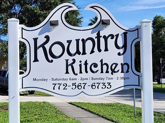 The bold black lettering of Kountry Kitchen&rsquo;s classic sign stands proudly against the Florida sunshine, inviting early risers to step inside for a hearty homestyle breakfast.