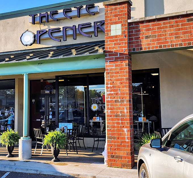 The Eye Opener's storefront beckons with its distinctive blue signage and inviting brick facade&mdash;breakfast paradise hiding in plain sight.