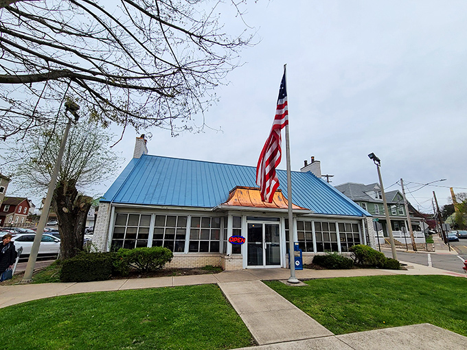 The iconic blue roof and American flag welcome hungry travelers like a breakfast beacon on the Pennsylvania horizon.