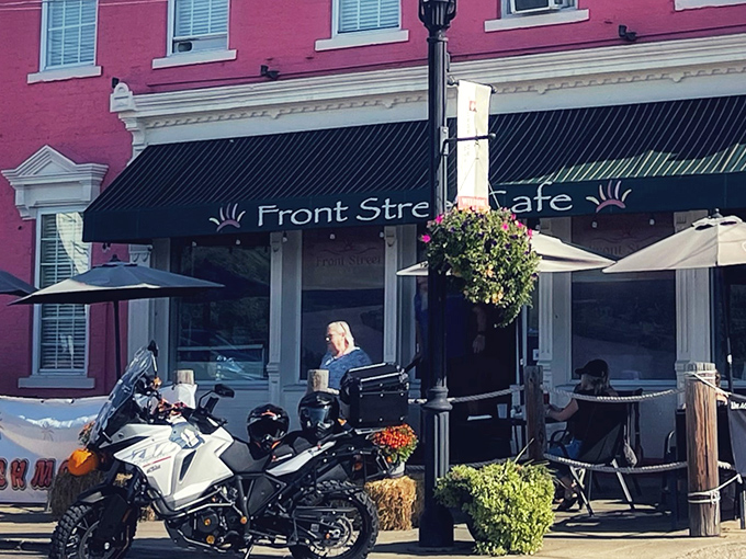 The salmon-pink exterior of Front Street Caf&eacute; stands like a culinary lighthouse on New Richmond's riverfront, beckoning hungry travelers with its charming historic fa&ccedil;ade. 