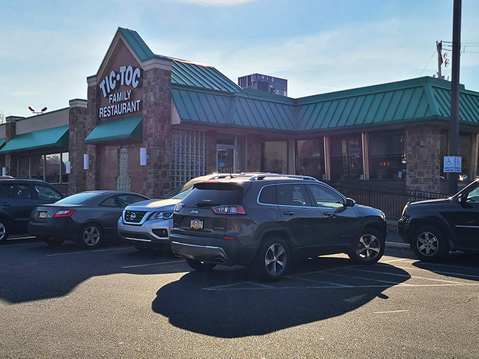 The iconic green-roofed stone facade of Tic-Toc Family Restaurant stands ready to welcome hungry travelers. Time really does stand still for good food.