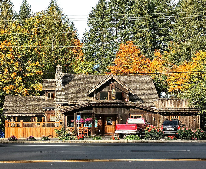 Fall's golden embrace highlights this mountain hideaway, where vibrant foliage frames the cafe's timber exterior like Mother Nature's own Instagram filter.
