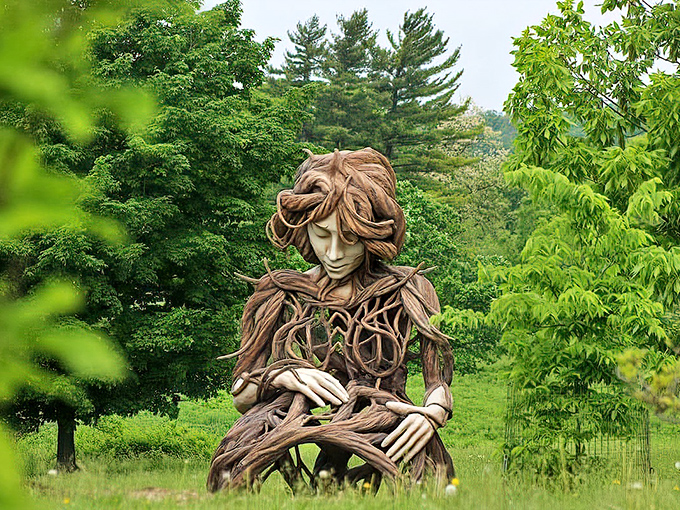 Mother Nature herself seems to have taken a seat in the garden, her wooden form a reminder that we're all just visitors in her leafy domain.